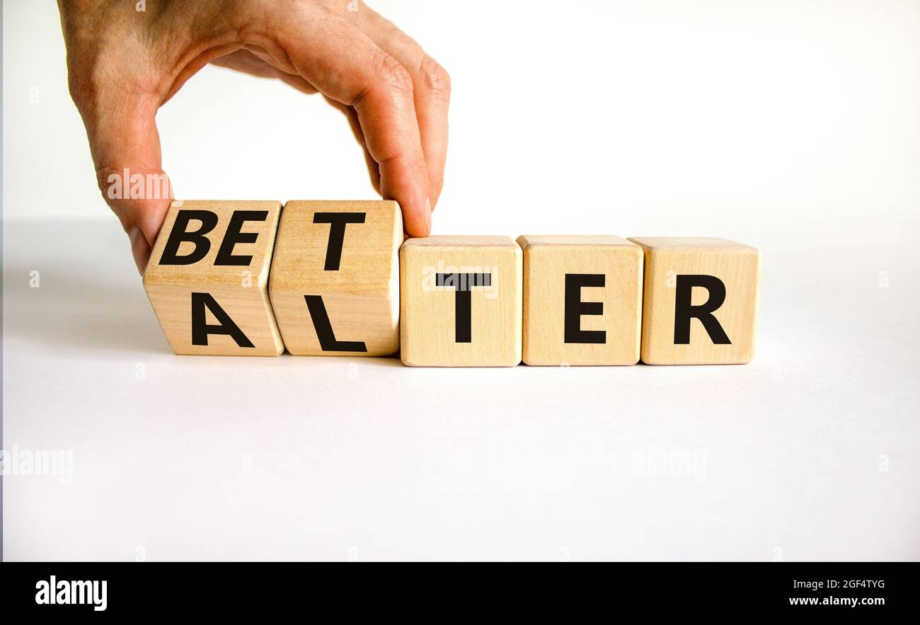 Alter or better symbol. Businessman turns wooden cubes and changes the ...
