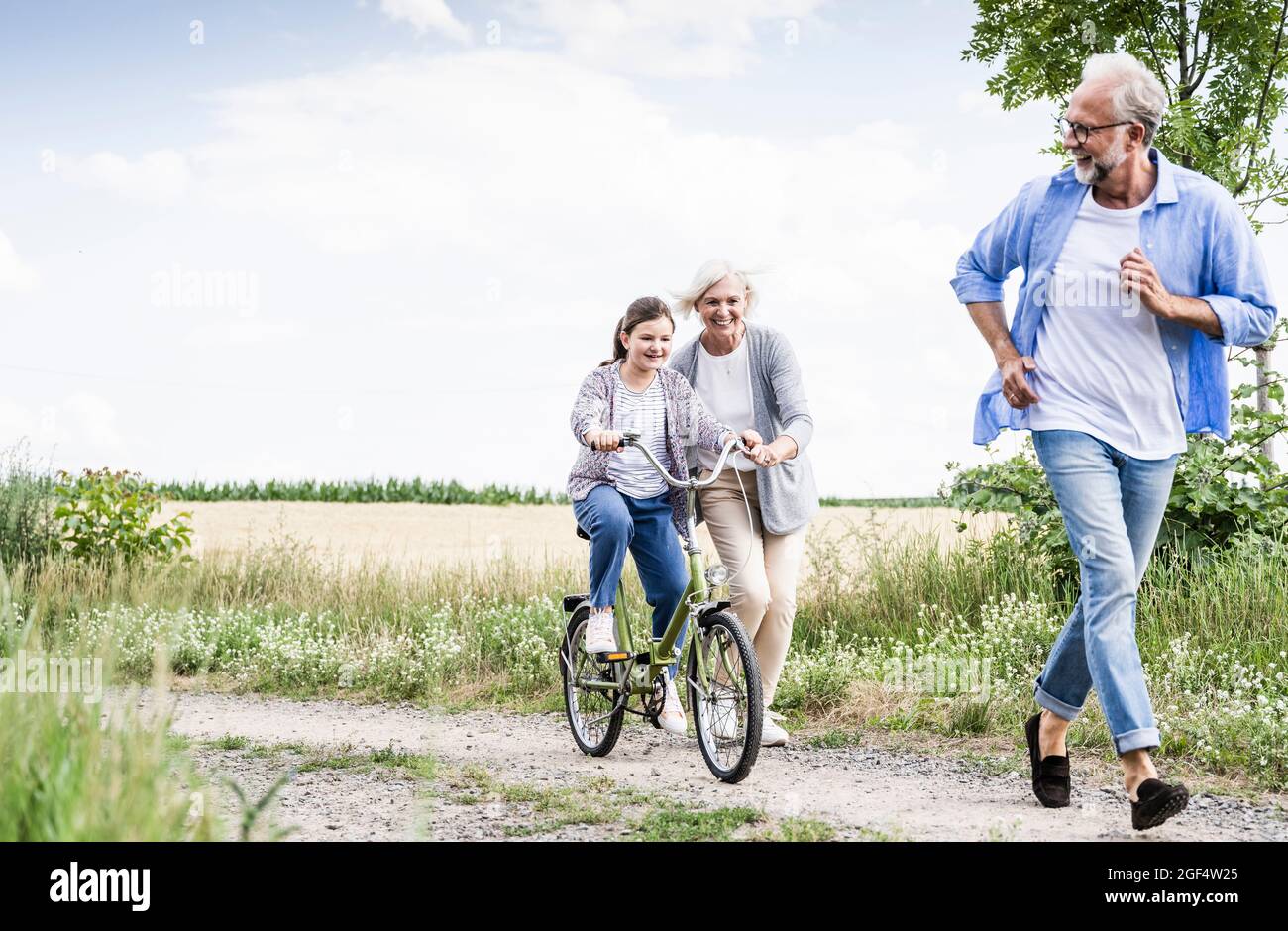 Couple man woman riding bicycle hi-res stock photography and images - Alamy