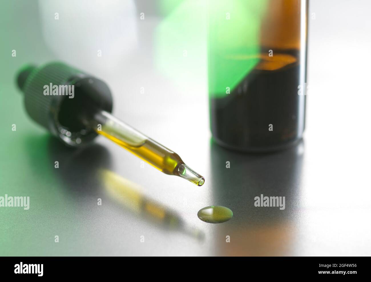 Medicine dropper yellow hi-res stock photography and images - Alamy