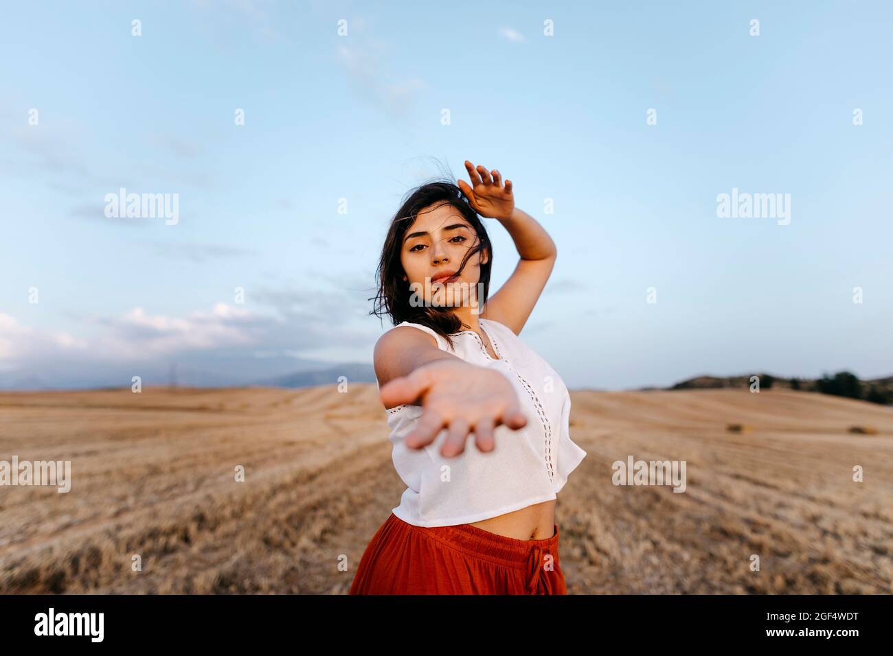 Woman dancing at sunset hi-res stock photography and images - Alamy