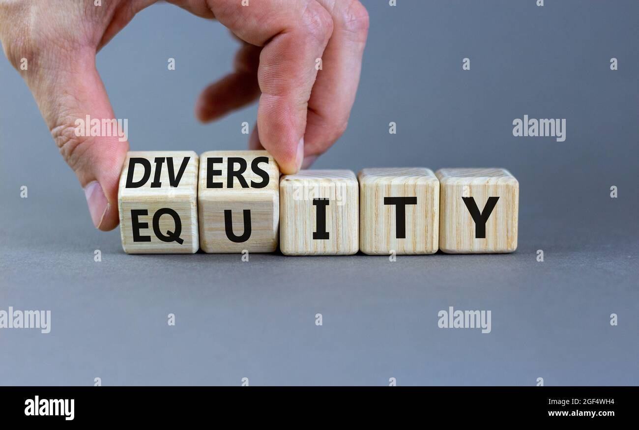 Diversity and equity symbol. Businessman turns wooden cubes, changes ...