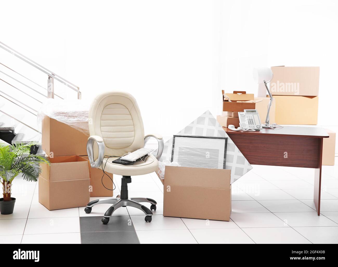 Move concept. Unpacking cardboard boxes in a new office Stock Photo - Alamy