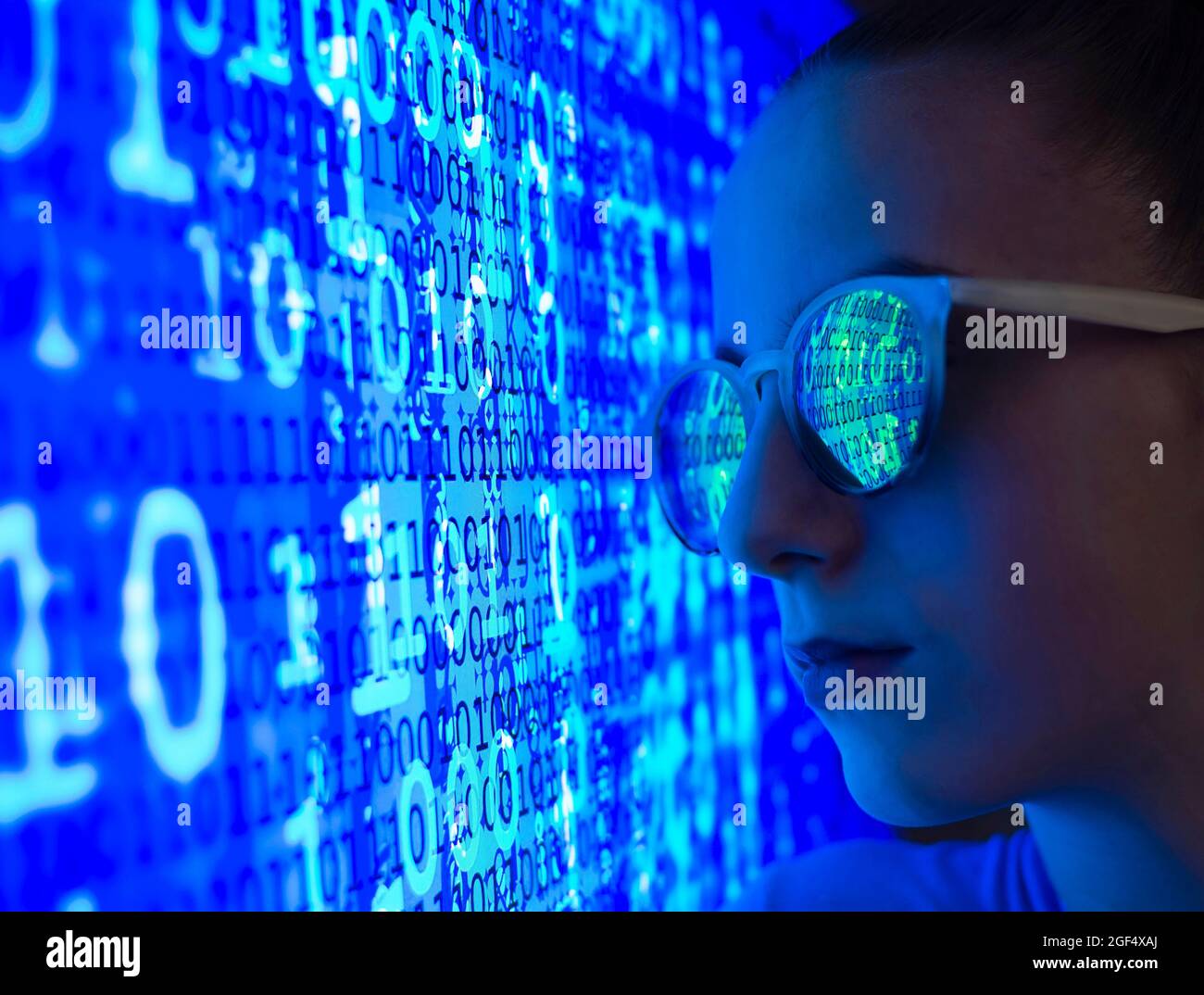 Female computer hacker with binary code reflection on eyeglasses Stock Photo - Alamy