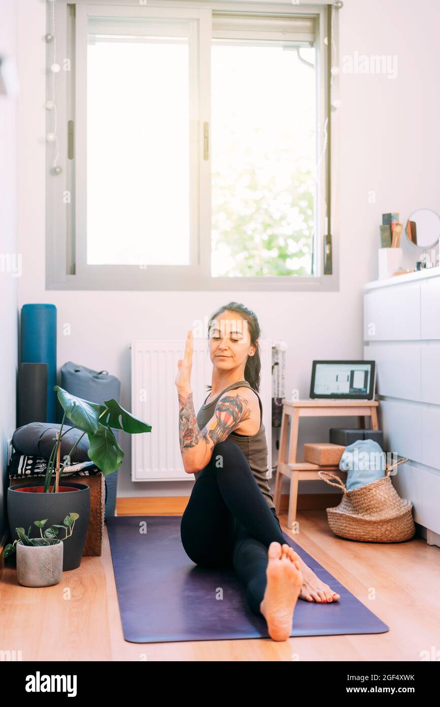 Adult female practicing yoga hi-res stock photography and images - Alamy