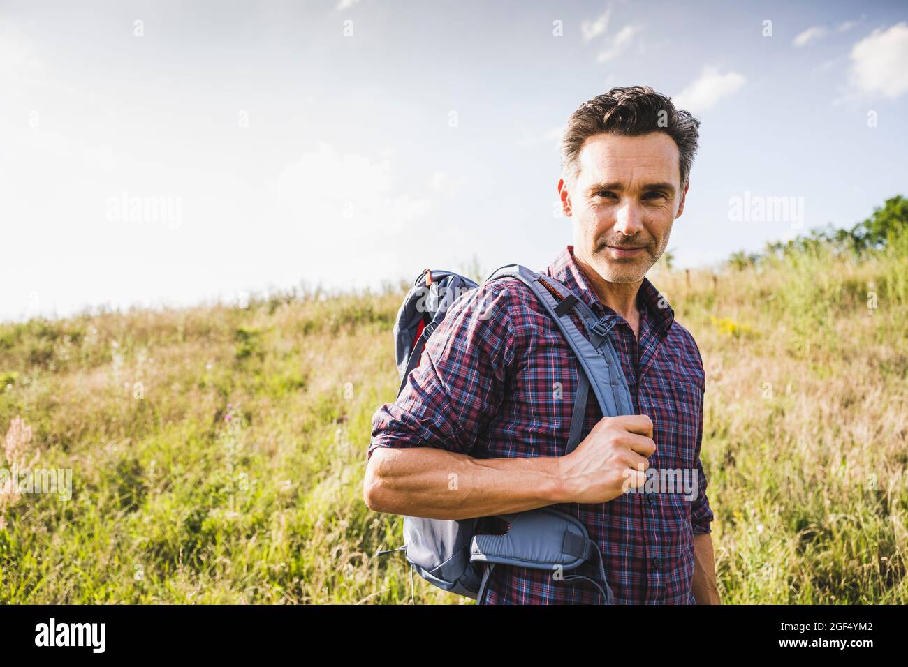 Mature man carrying backpack hi-res stock photography and images - Alamy