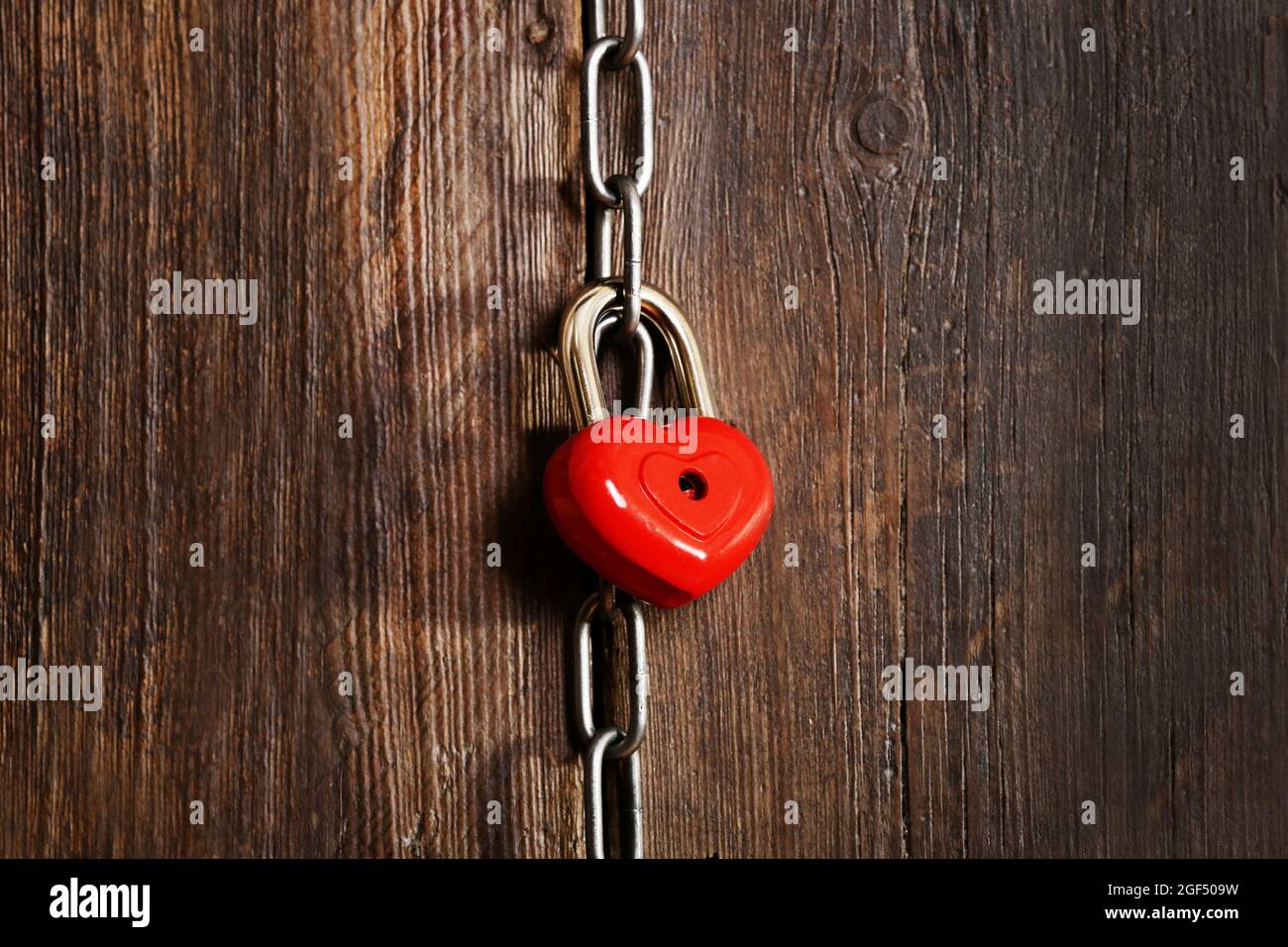 Valentine concept. Love heart hanging on chain Stock Photo - Alamy