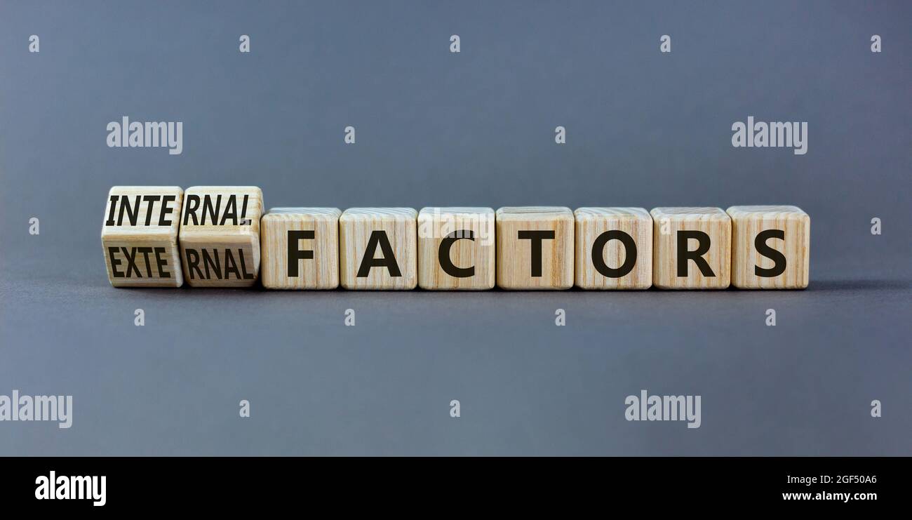 External or internal factors symbol. Turned wooden cubes and changed ...