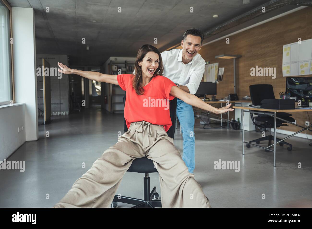 Man standing behind chair hi-res stock photography and images - Alamy