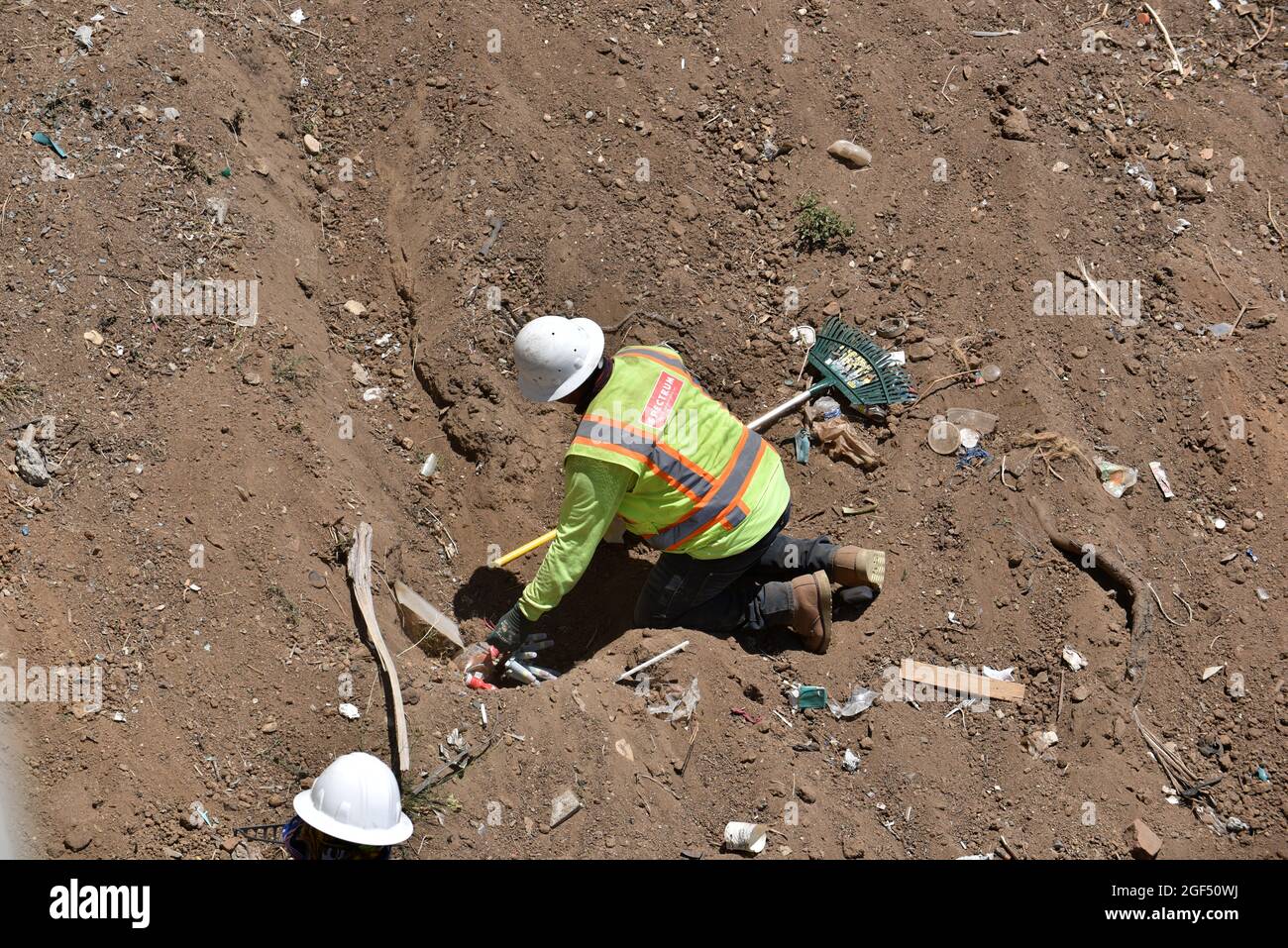 Los Angeles, CA USA - June 30, 2021: City employees cleaning up trash ...