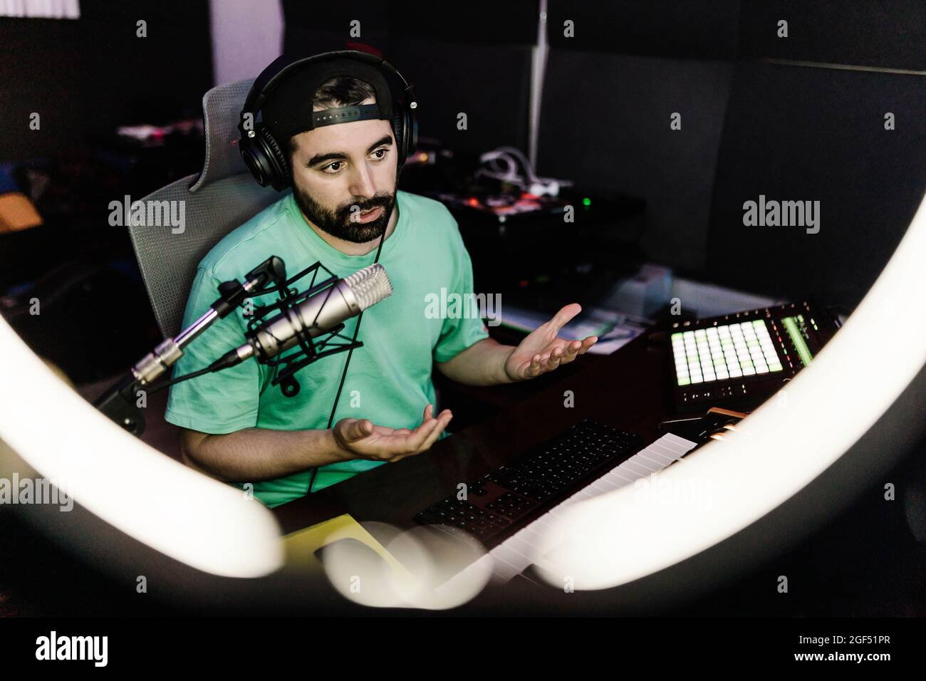 Mature male artist recording music in studio Stock Photo - Alamy