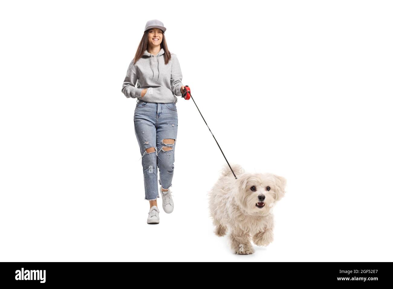 Teen girl walking dog Cut Out Stock Images & Pictures - Alamy