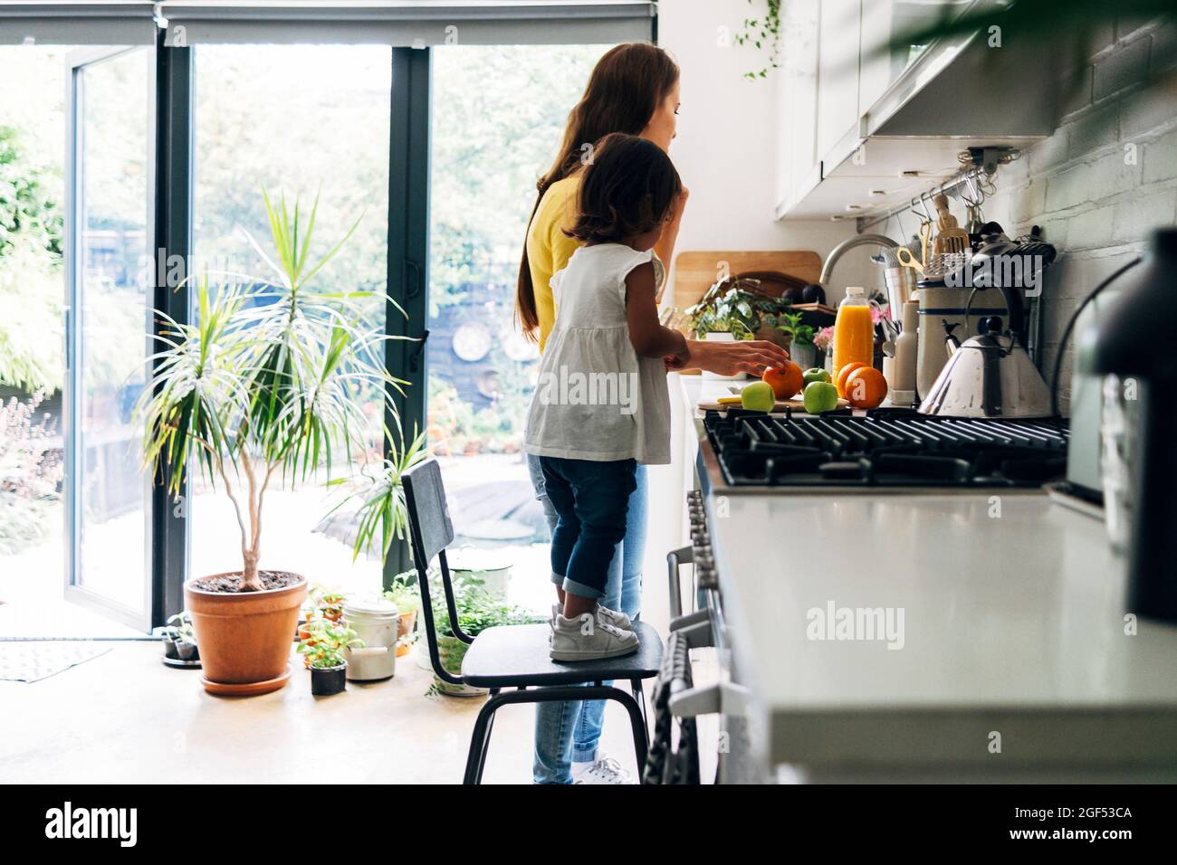 Woman In Kitchen Standing