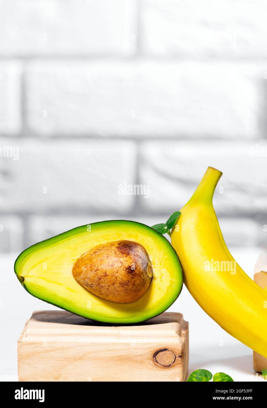 Creative avocado, banana and micro green balance wooden stands and ...