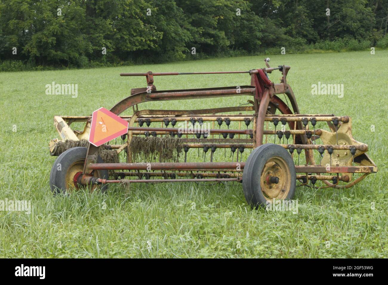 Farm rake in the field Stock Photo - Alamy