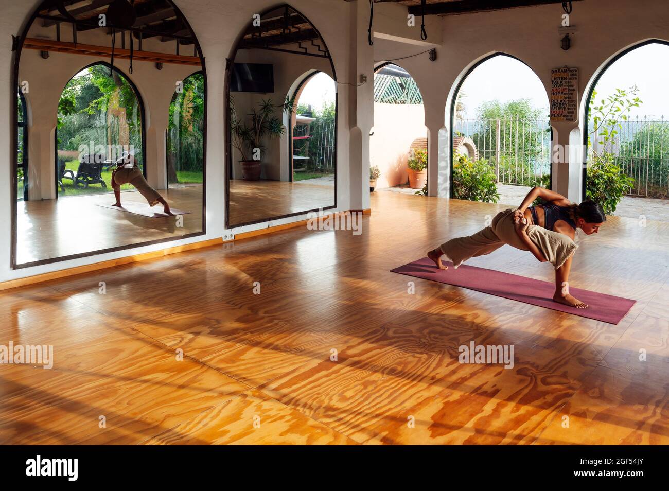 Female doing yoga in mirror hi-res stock photography and images - Alamy