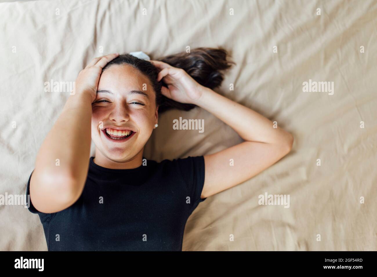 Girl hands on hair hi-res stock photography and images - Alamy