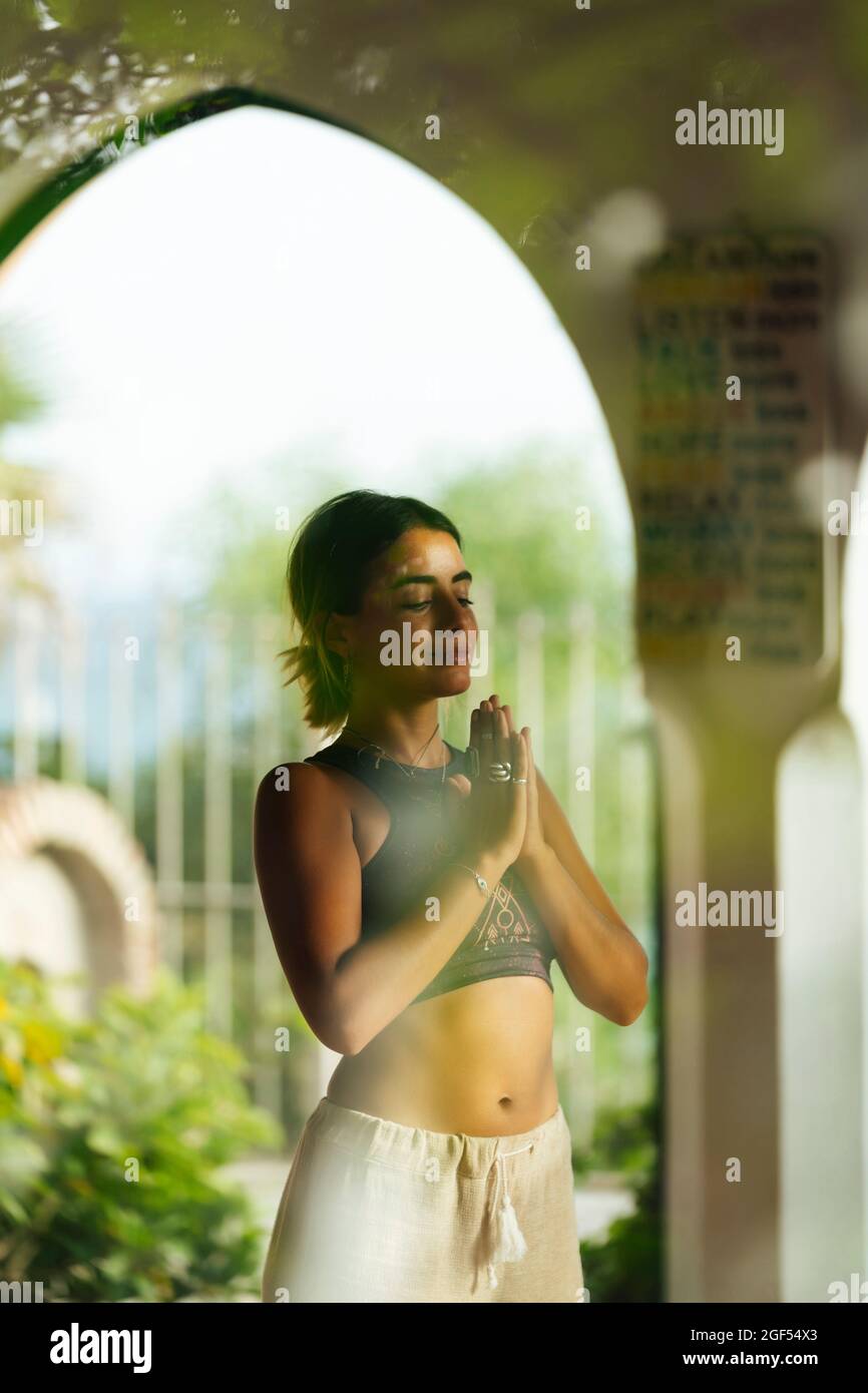 Woman standing clasped hands hi-res stock photography and images - Alamy