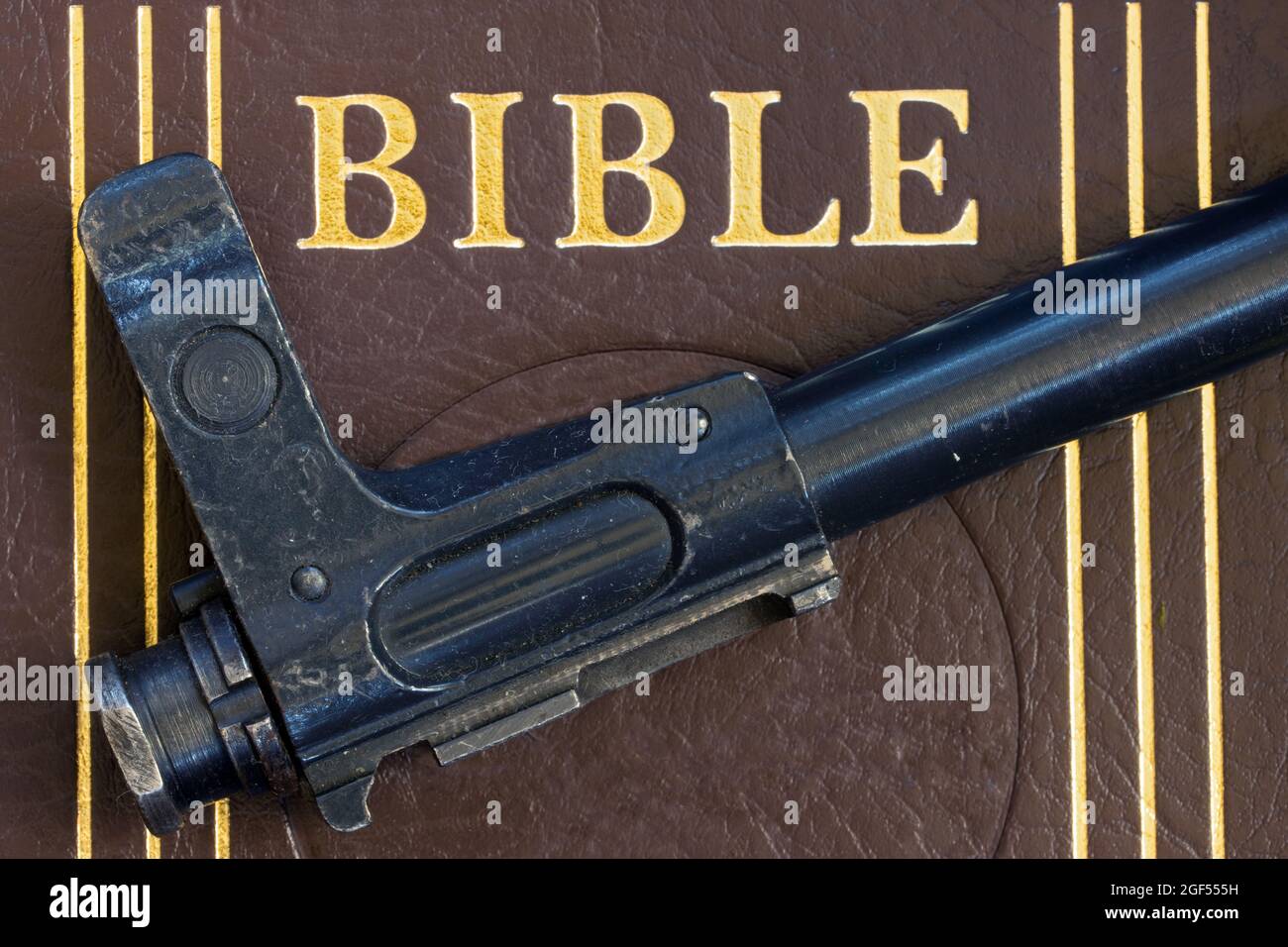 Gun and bible hi-res stock photography and images - Alamy