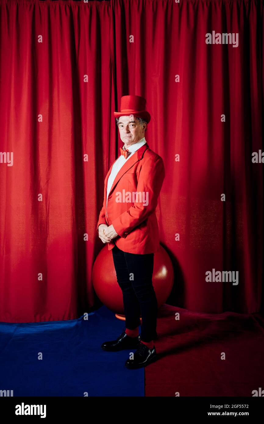 Mature male artist standing on stage in circus Stock Photo - Alamy