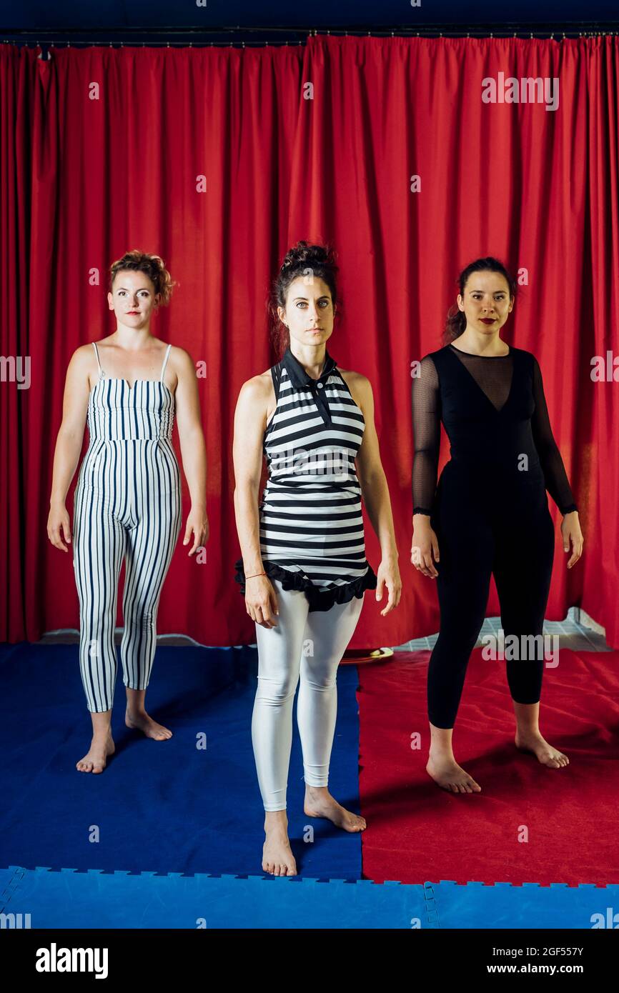 Female circus artists staring while standing on stage Stock Photo - Alamy