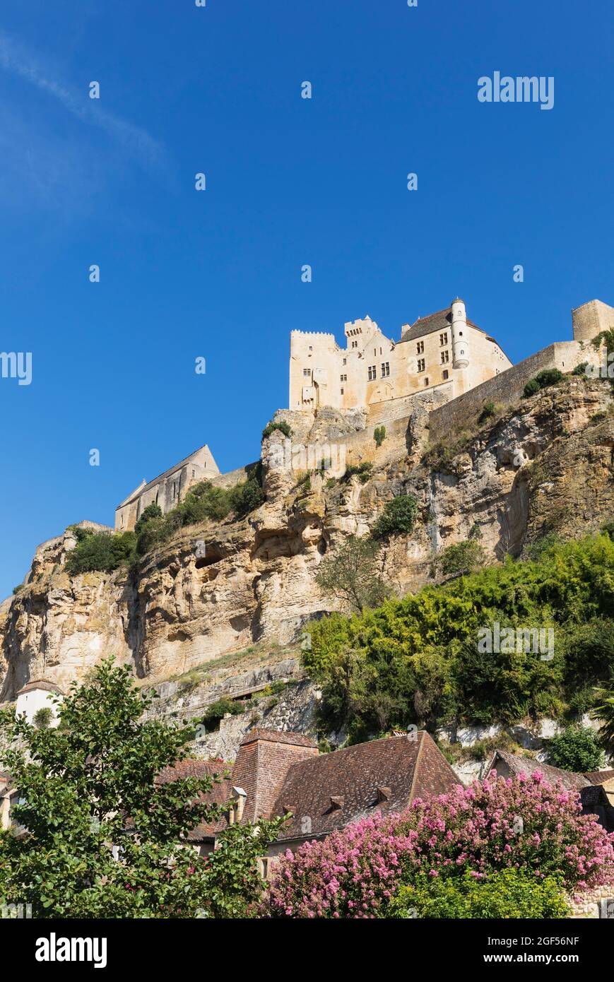 Clear sky clifftop castle overlooking village below hi-res stock ...
