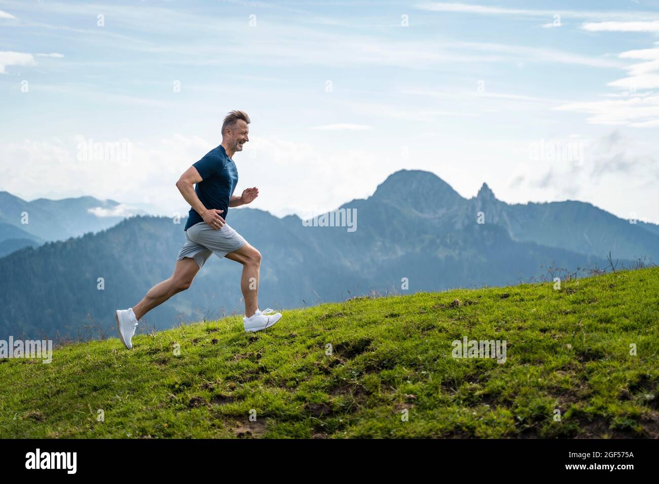 Man running mountain hi-res stock photography and images - Alamy