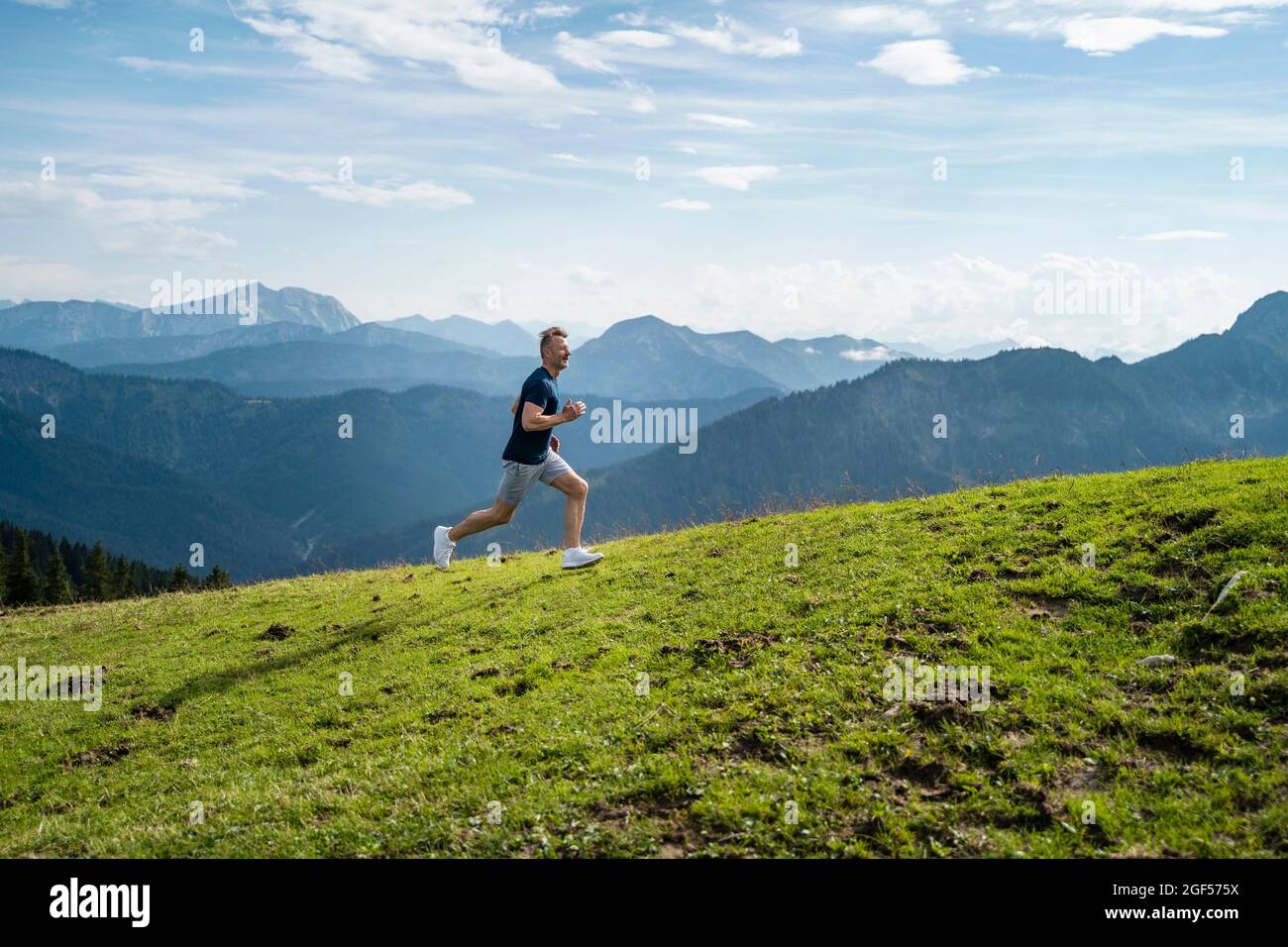 Man running on mountain cloud hi-res stock photography and images - Alamy