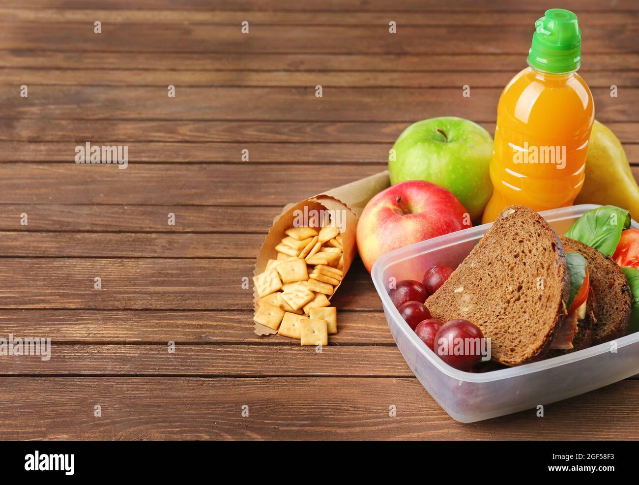 Kid school lunch on wooden background Stock Photo - Alamy