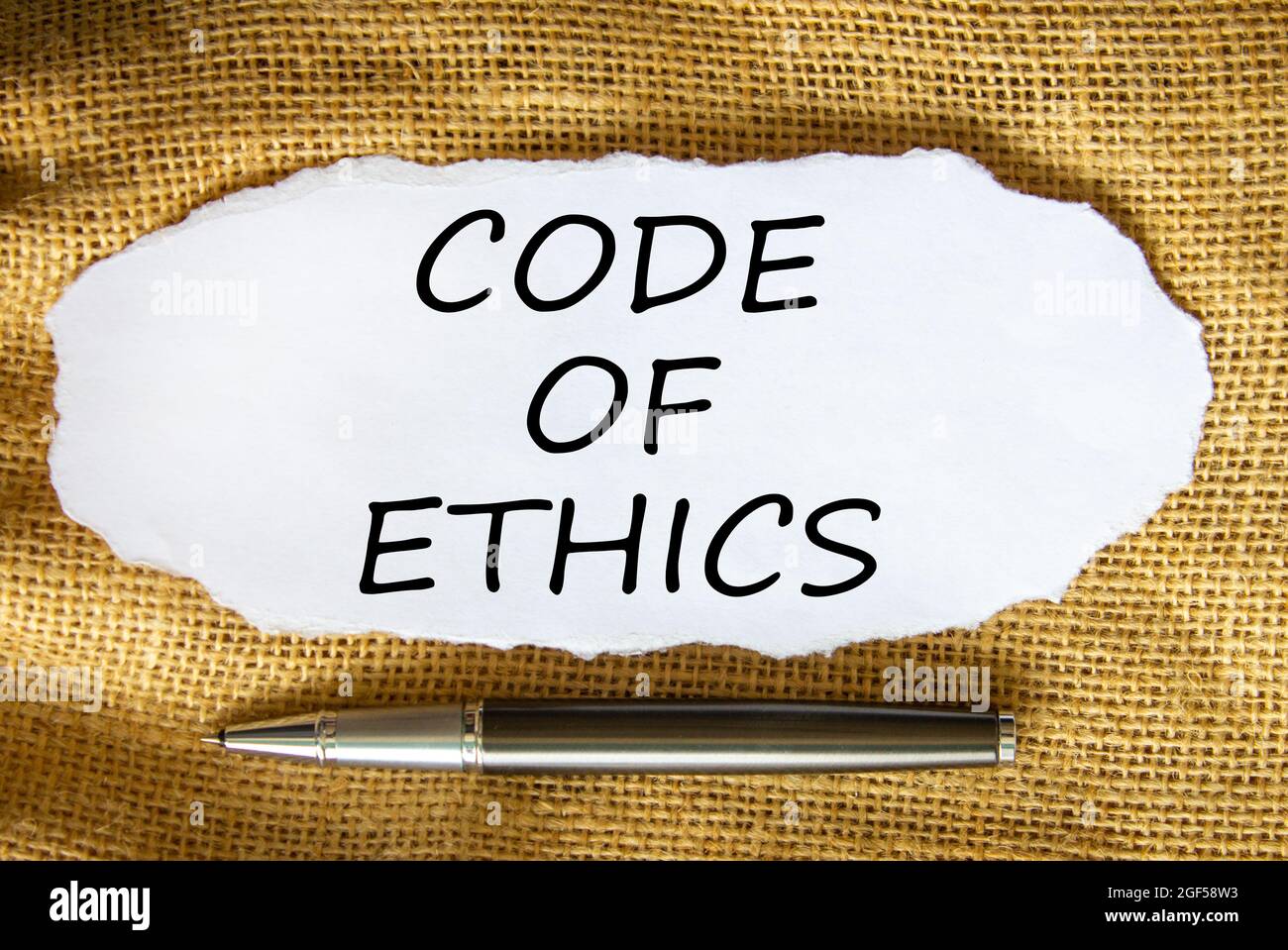 Code of ethics symbol. Words 'Code of ethics' on white paper. Black ...