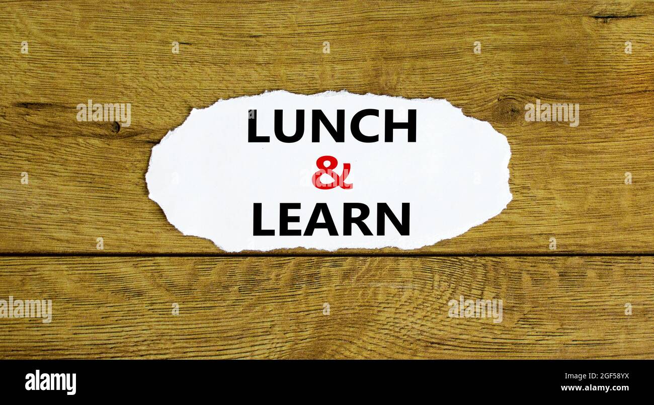 Lunch and learn symbol. Words 'Lunch and learn' on white paper ...