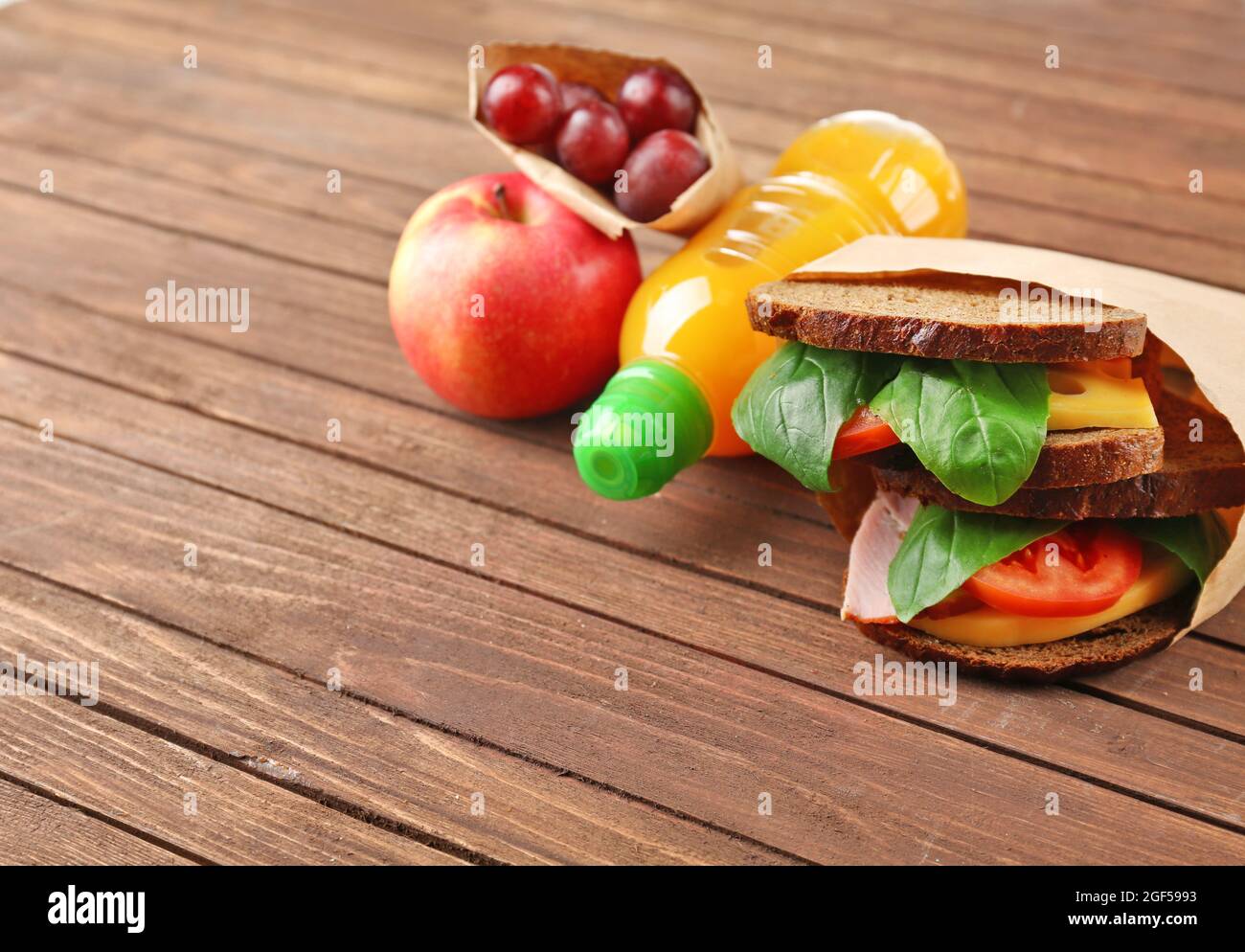 Kid school lunch on wooden background Stock Photo - Alamy