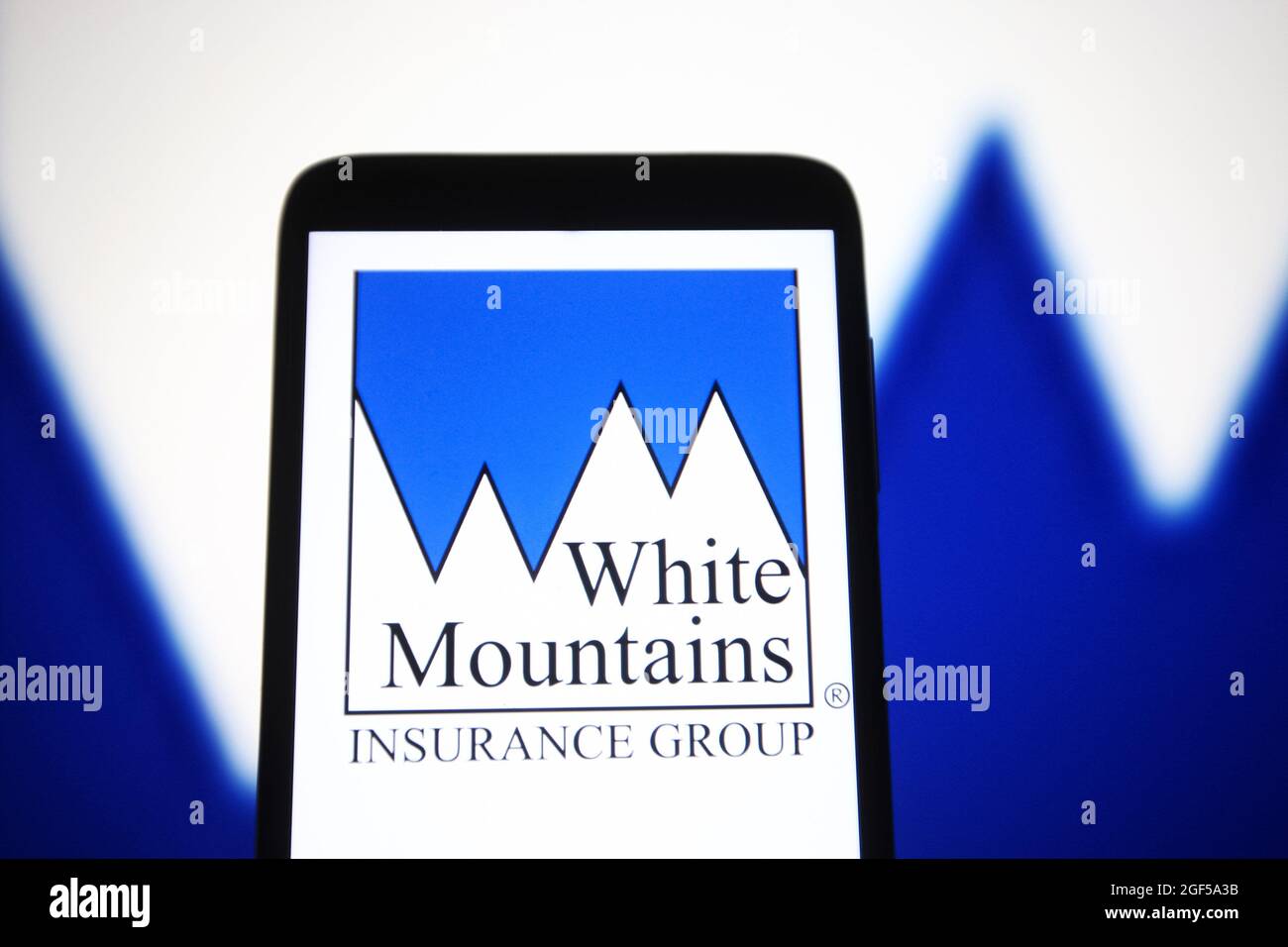 In this photo illustration, White Mountains Insurance Group logo is ...