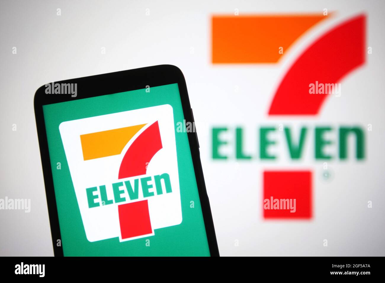 In this photo illustration, 7-Eleven logo is seen displayed on a ...
