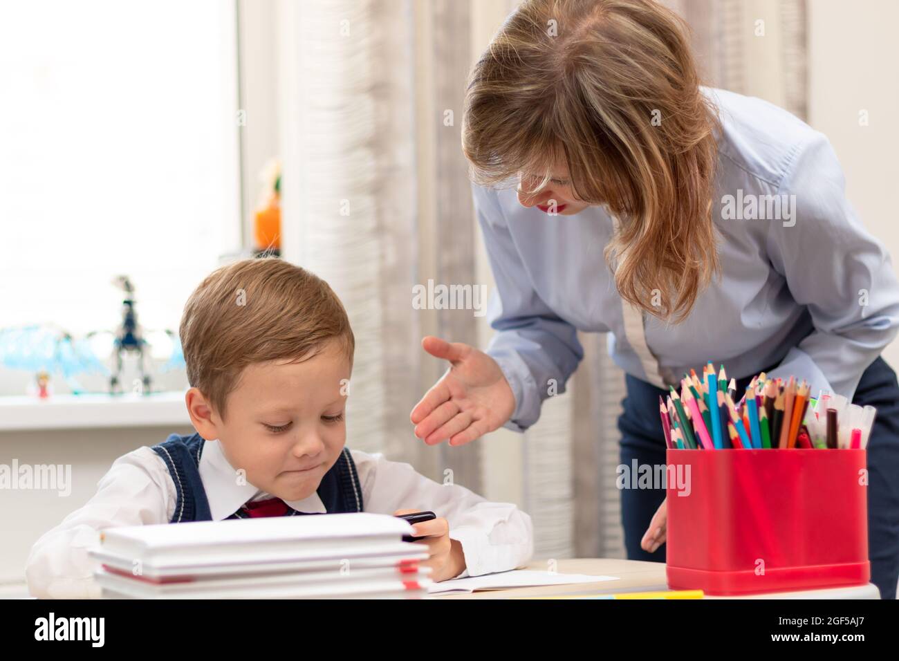 Boy school uniform home mom hi-res stock photography and images - Alamy