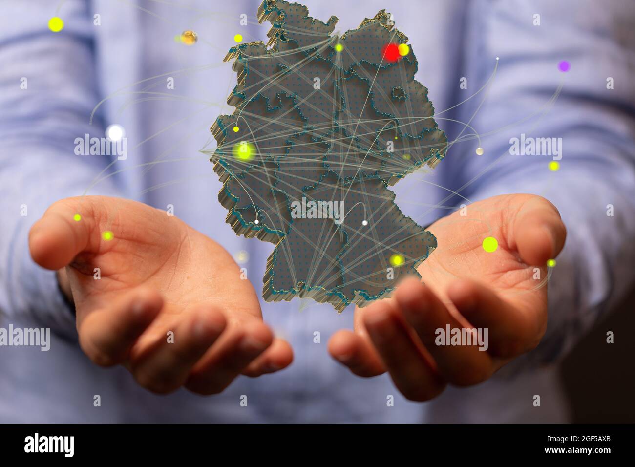 Person presenting the 3D render of the map of Germany consisting of ...