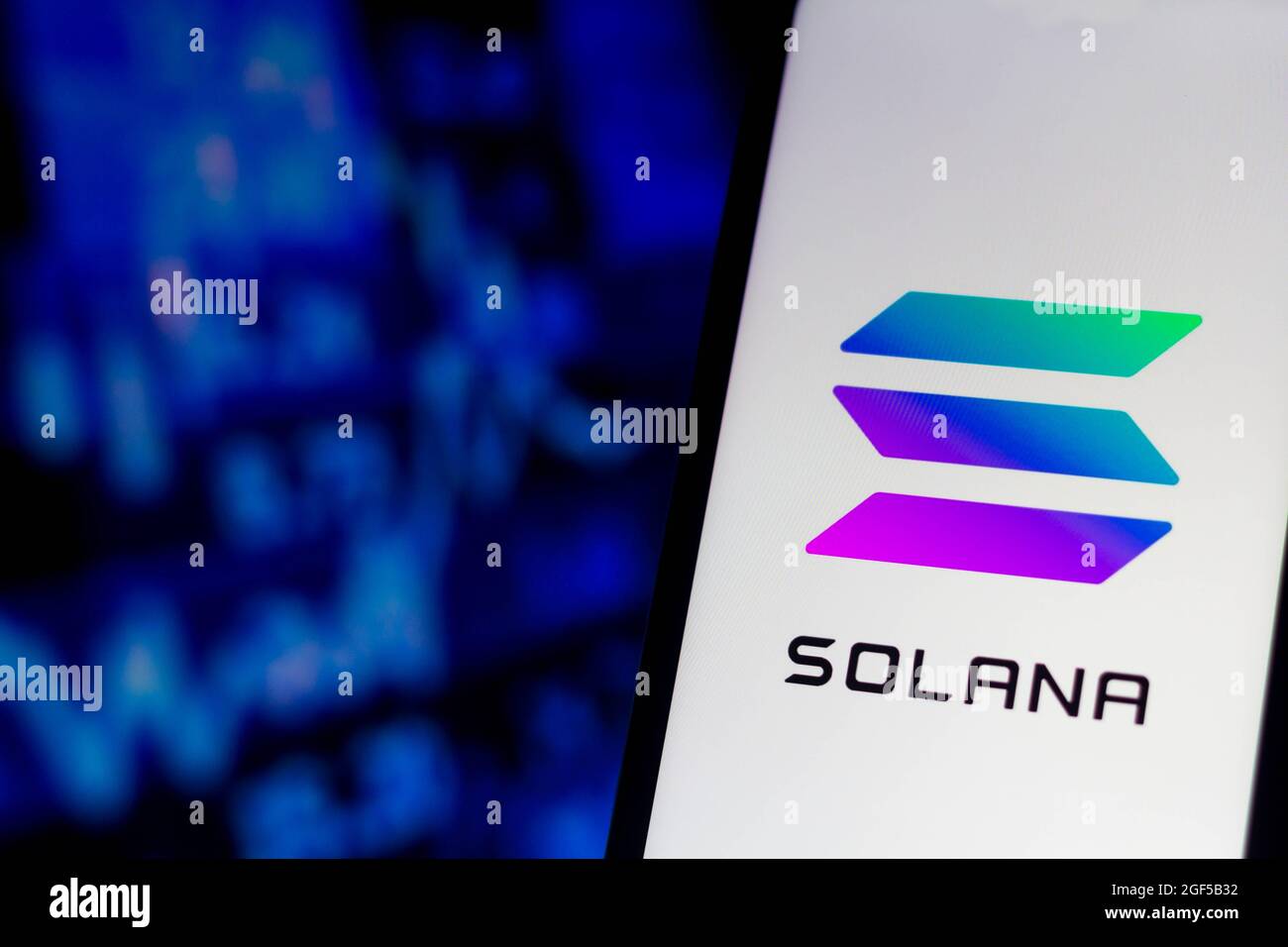 In this photo illustration the Solana logo seen displayed on a ...