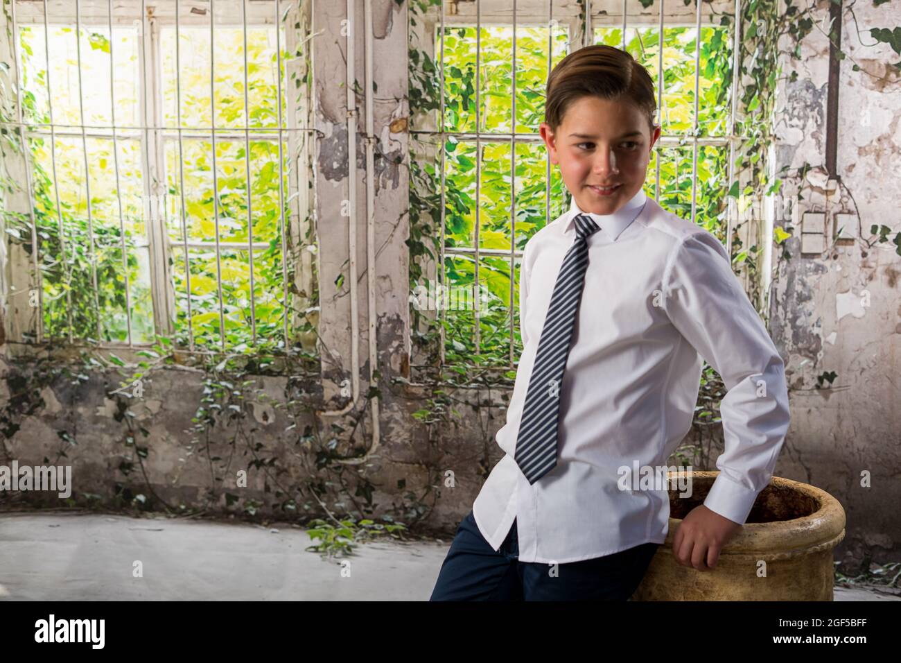 Adorable male child in a formal suit outfit posing Stock Photo - Alamy