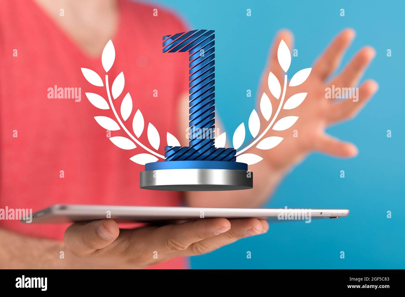 Man holding the blue 3D first place prize trophy with a laurel wreath ...