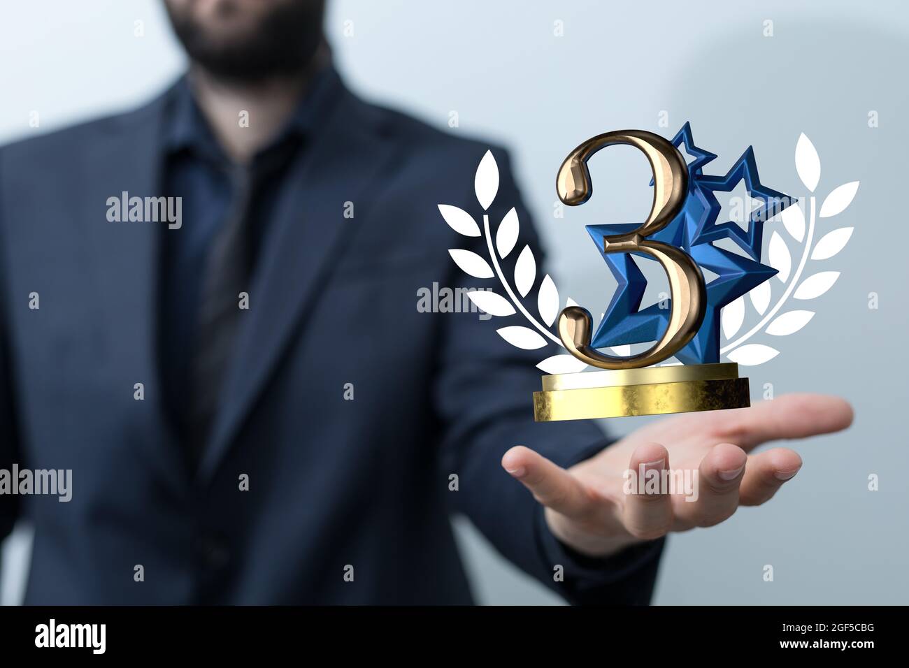 Man holding the 3D third place prize trophy with a laurel wreath Stock ...