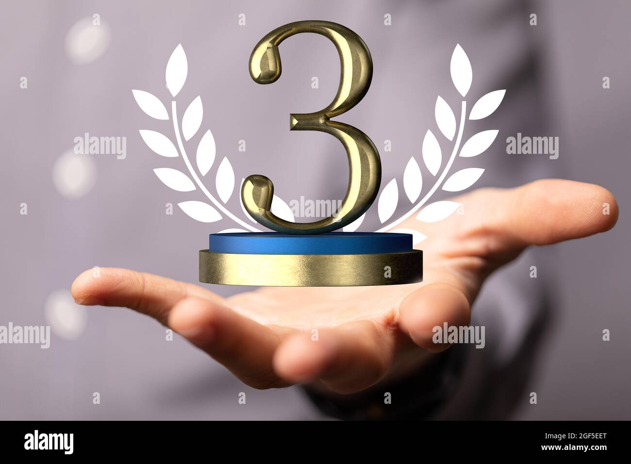 Person presenting a third-place award Stock Photo - Alamy