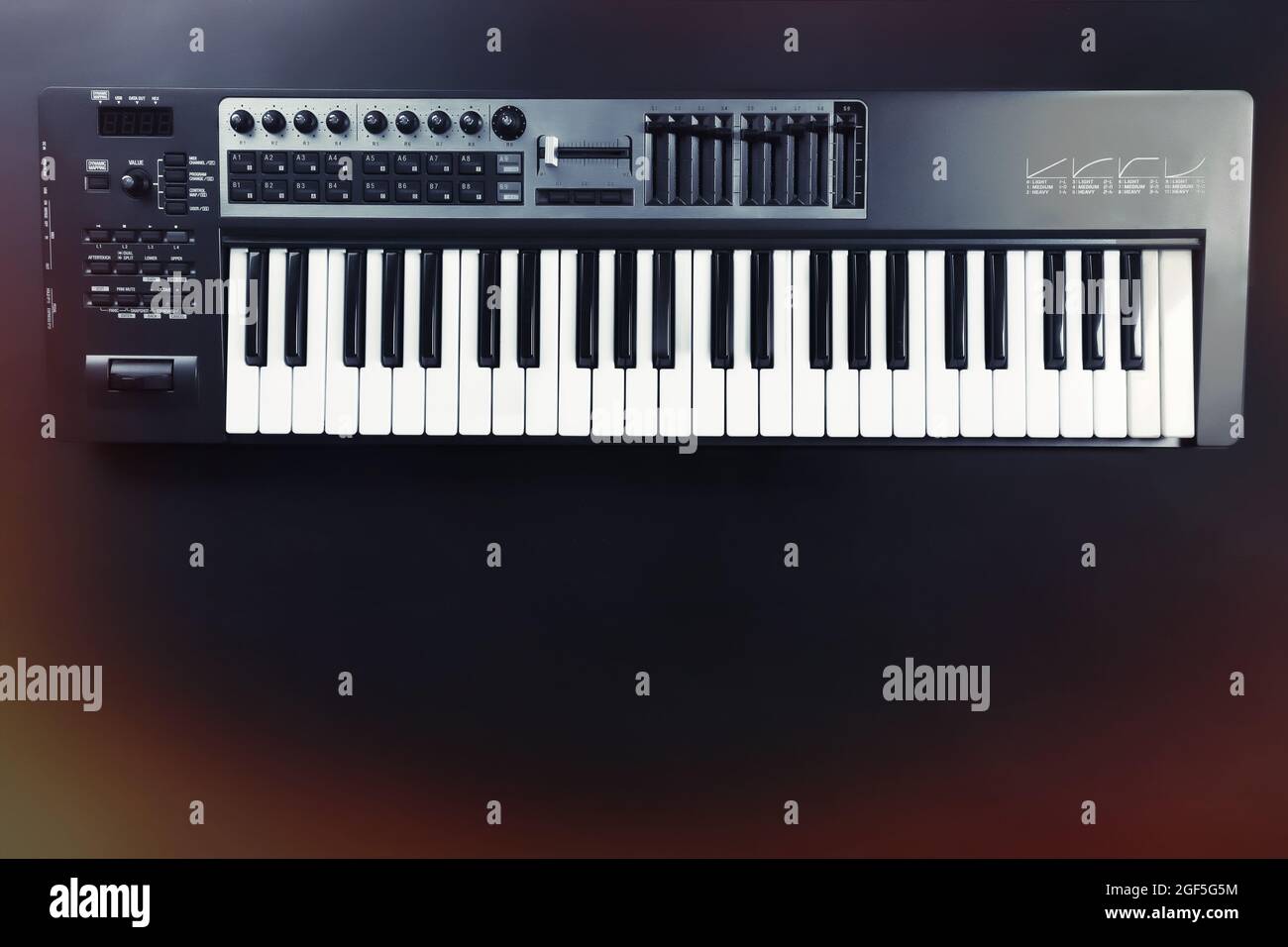 Keyboard of synthesizer on black background Stock Photo - Alamy