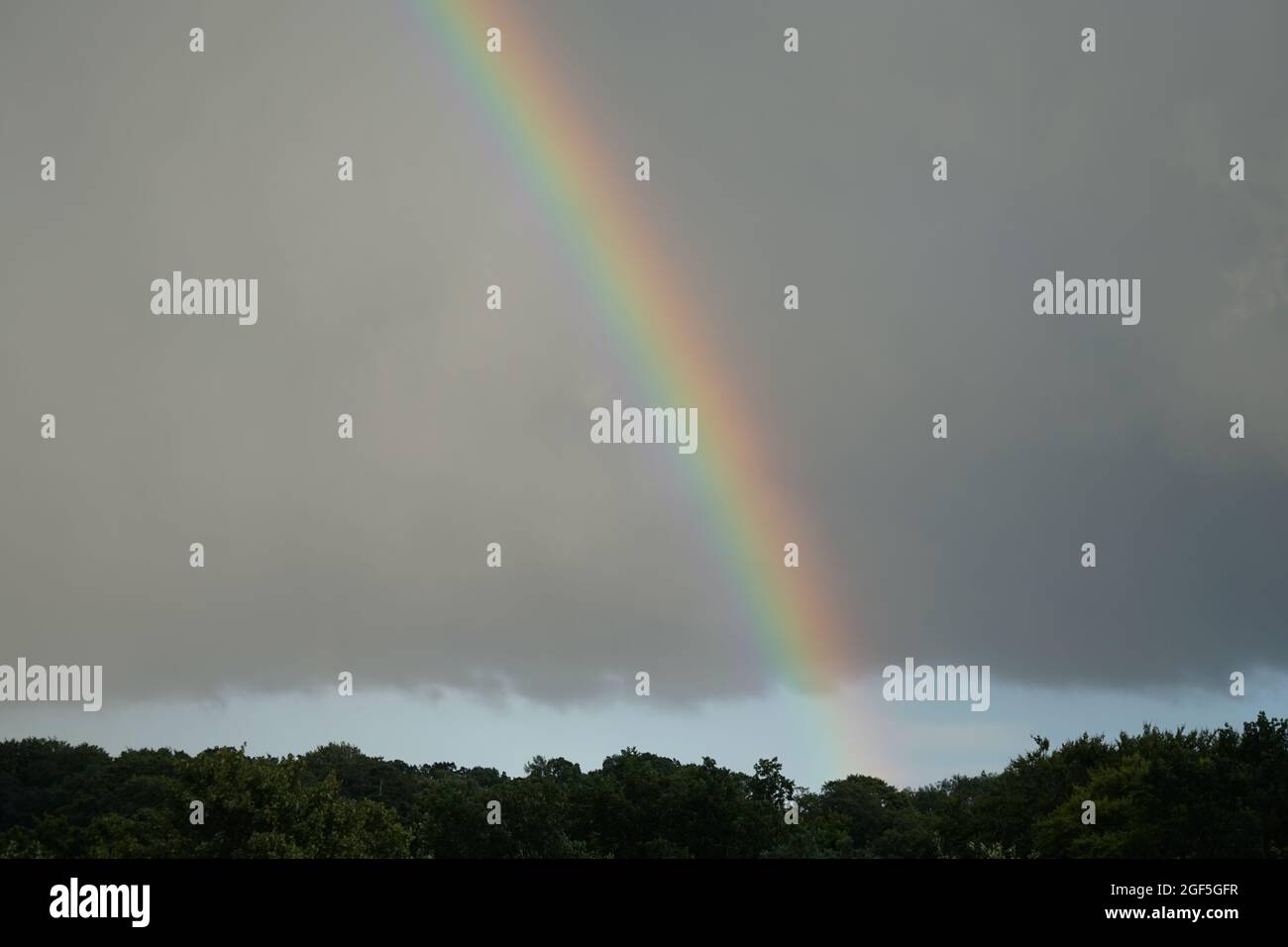 Rainbow with grey sky hi-res stock photography and images - Alamy