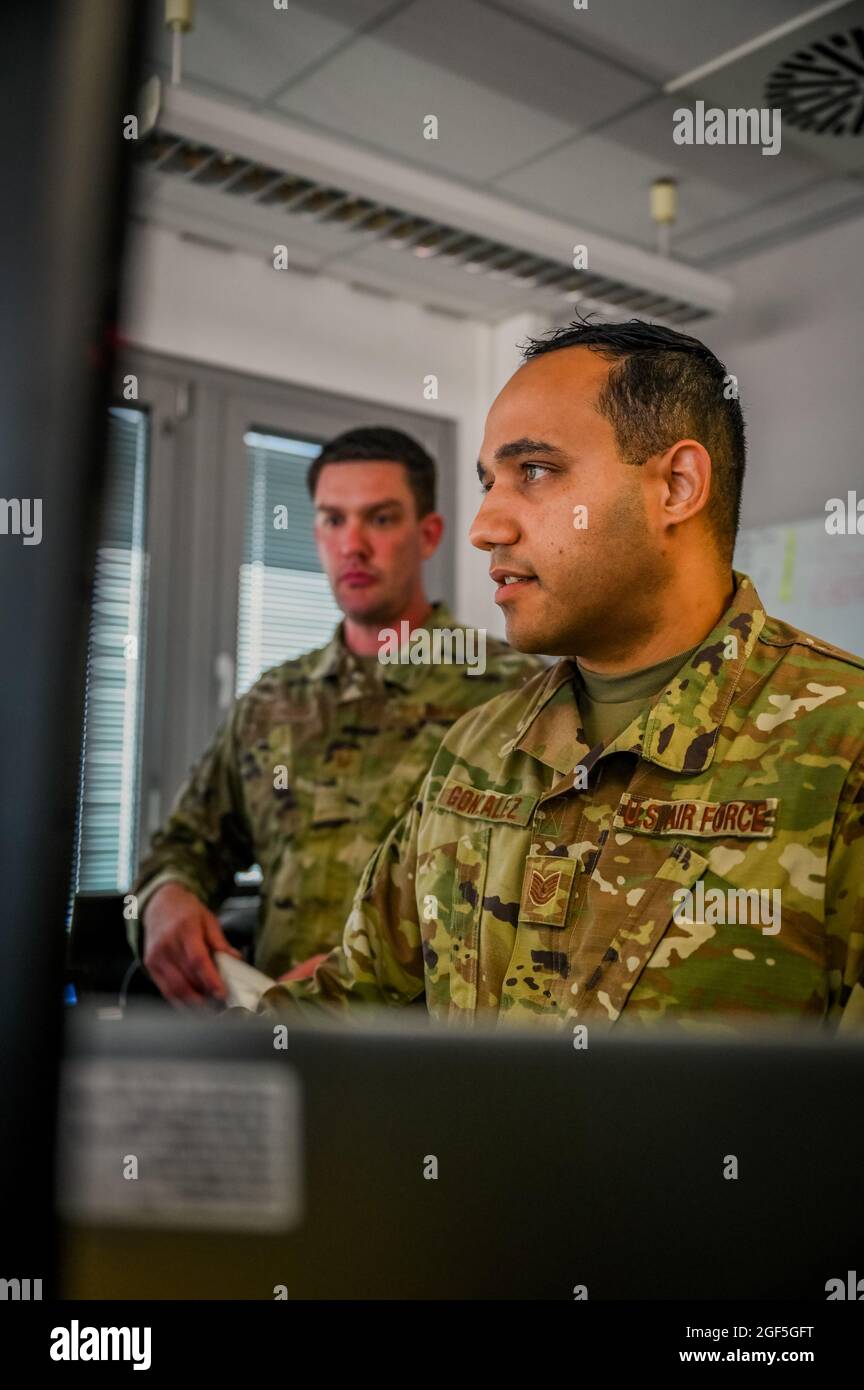 Airmen assigned to the 721st Aerial Port Squadron provide support to ...