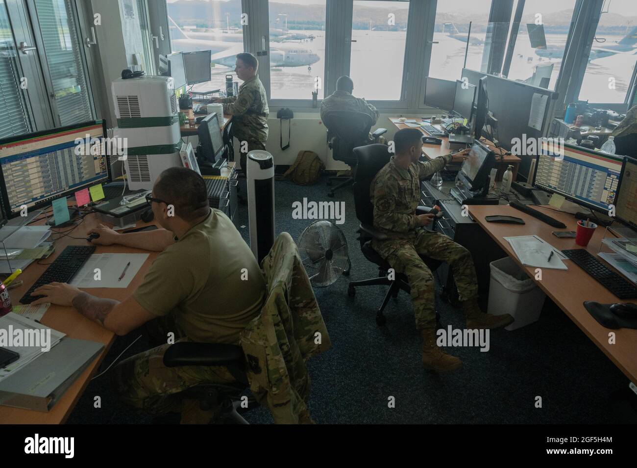 Members of the Maintenance Operations Center monitor aircraft missions ...
