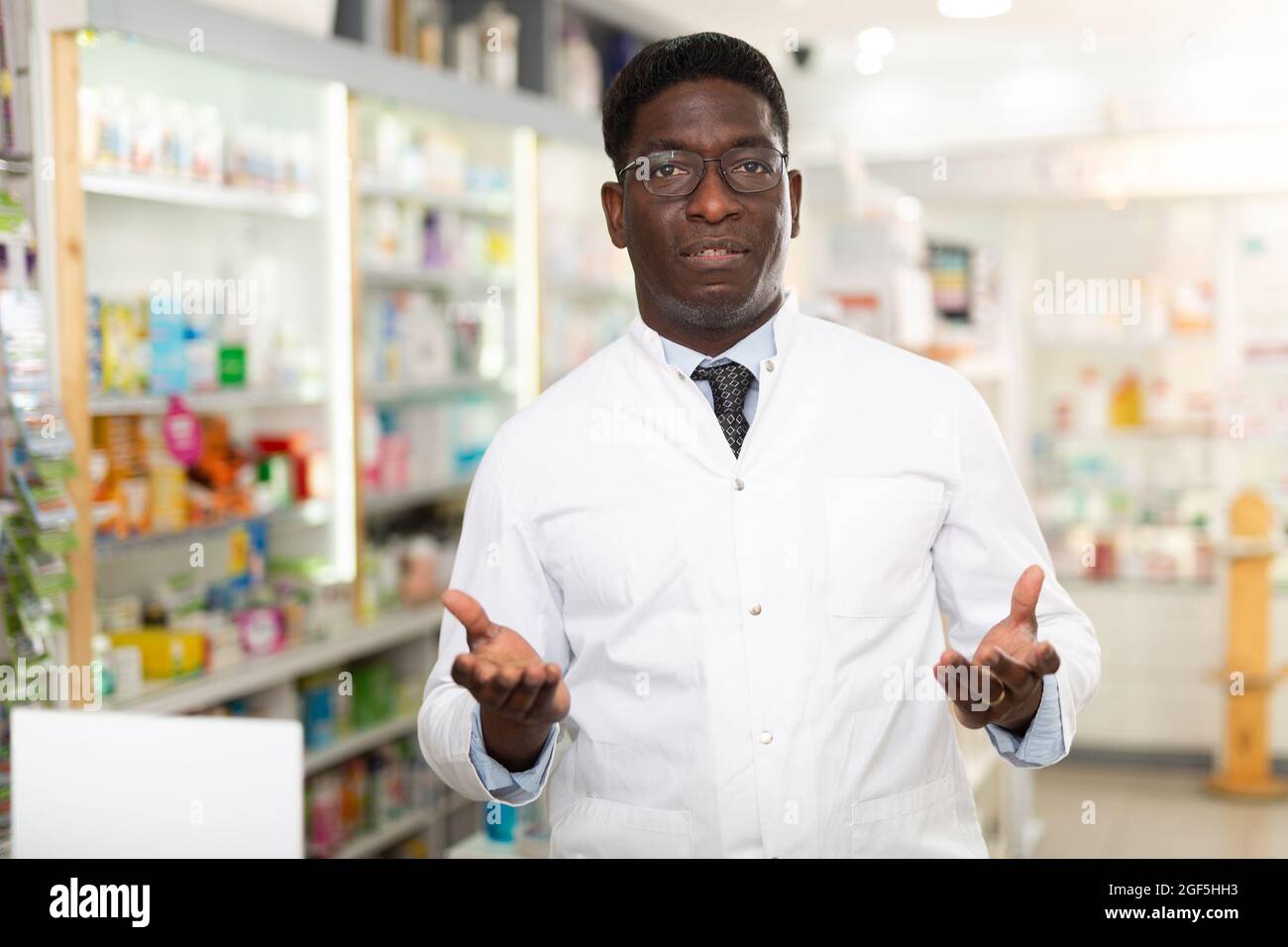 Portrait of pharmacist in gown Stock Photo - Alamy
