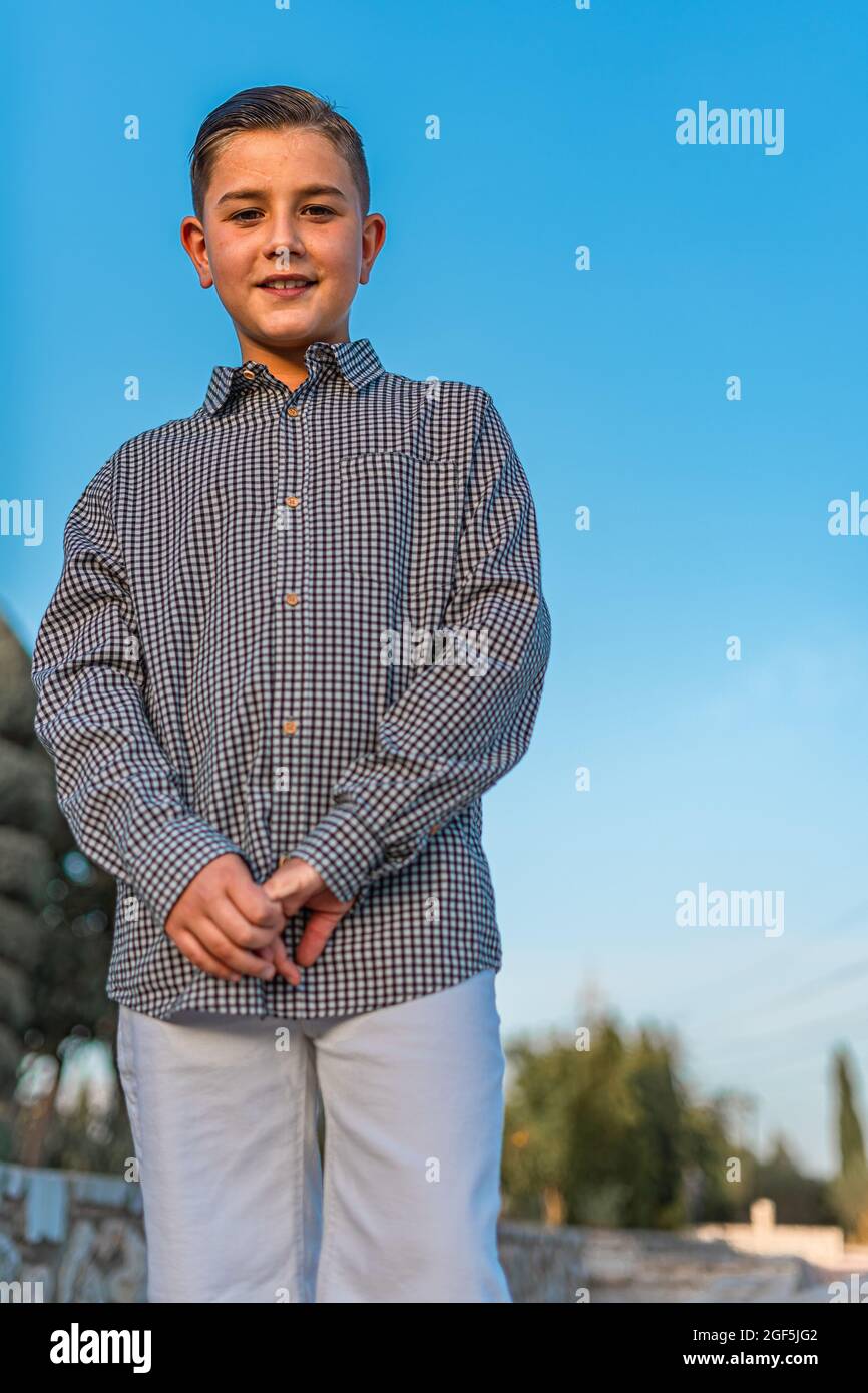 Vertical shot of an adorable male child in a formal outfit posing Stock ...