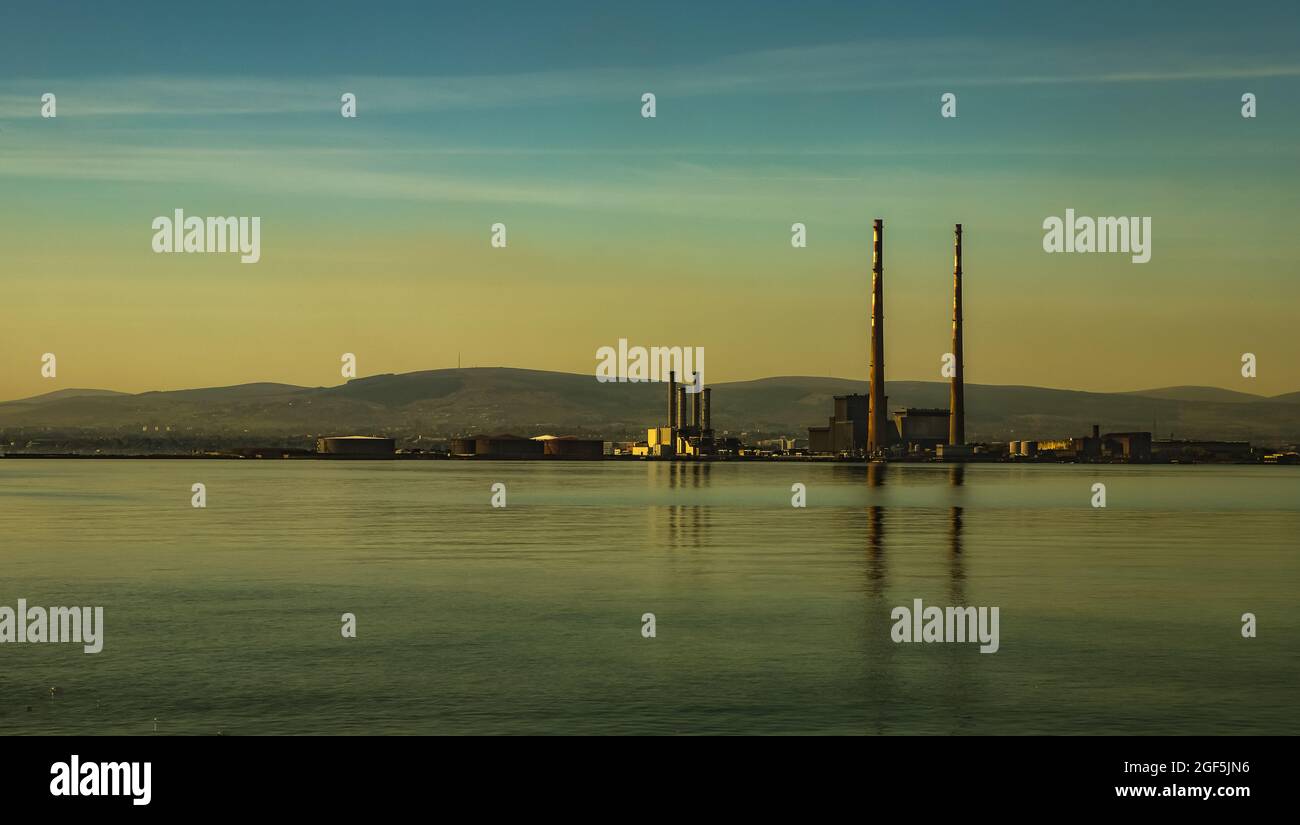 Poolbeg chimneys from Bull Island, Dublin, Ireland Stock Photo - Alamy