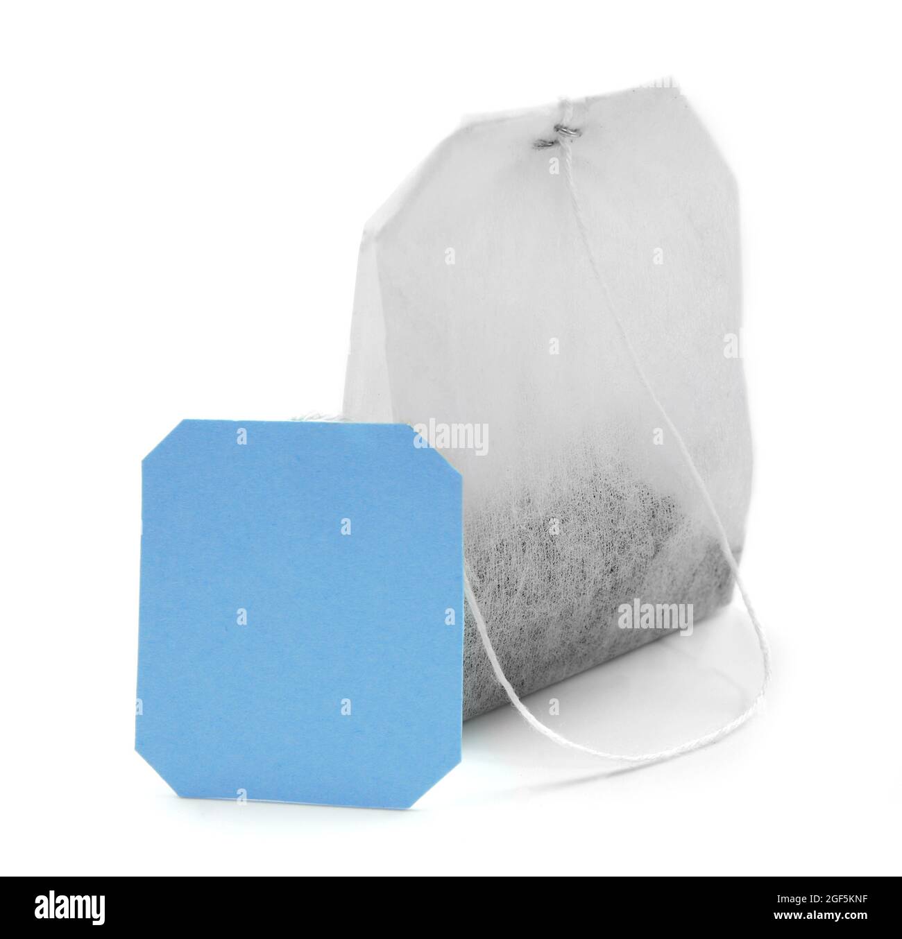 Teabag with blue label isolated on white background Stock Photo - Alamy