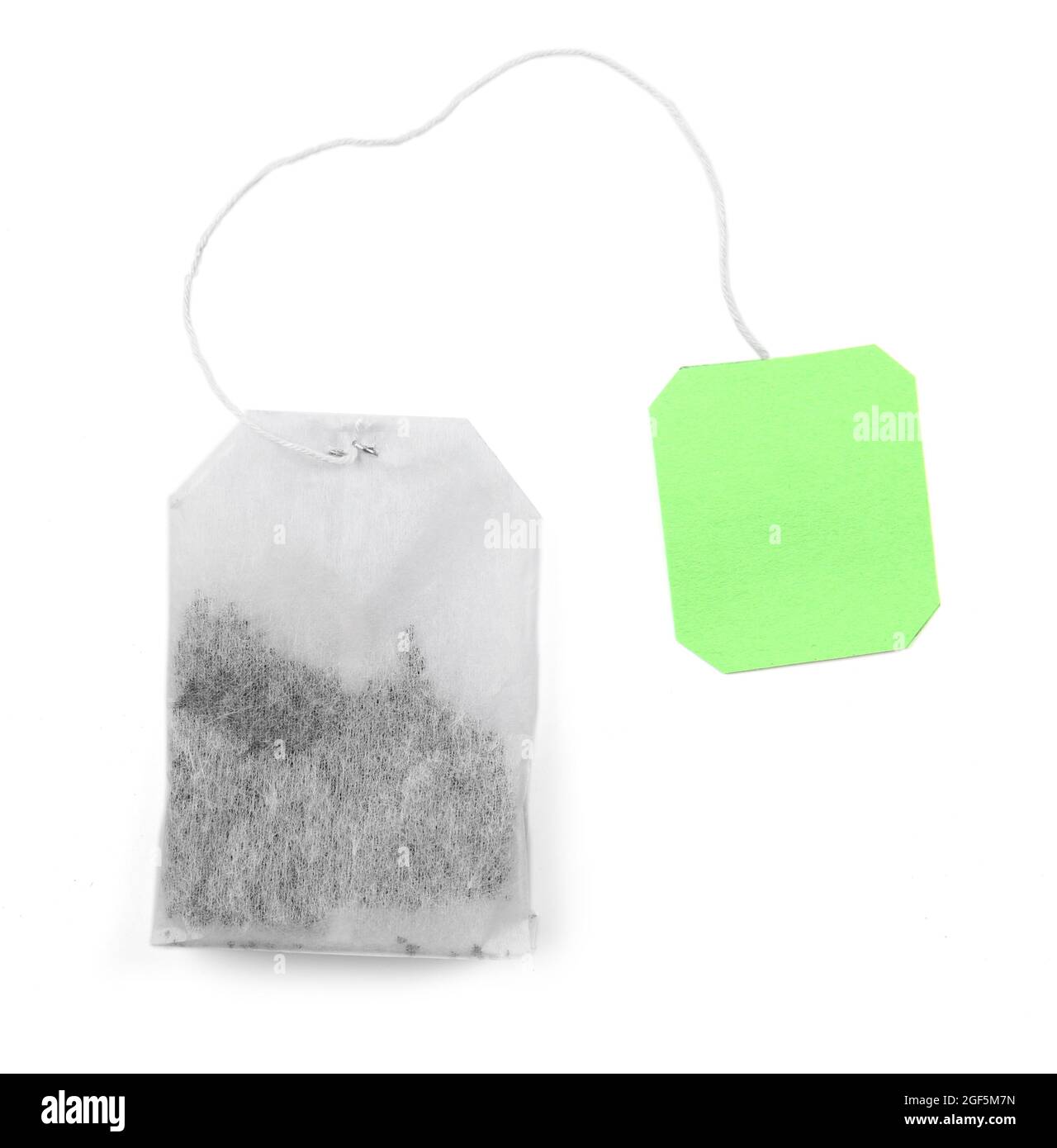 Teabag with green label isolated on white background Stock Photo - Alamy