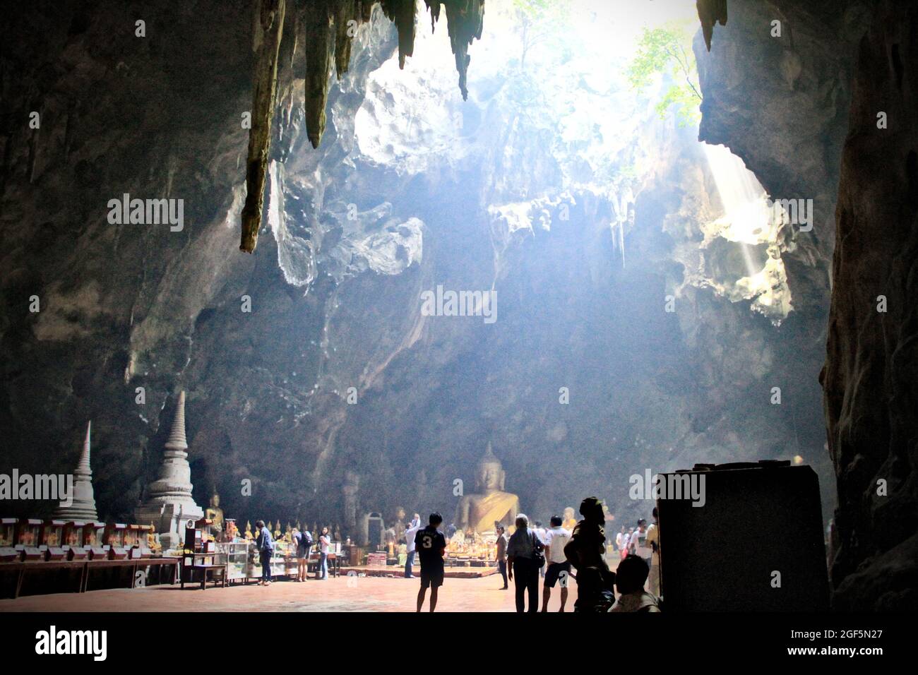 Cave temple with sun rays shining through in Thailand Stock Photo - Alamy